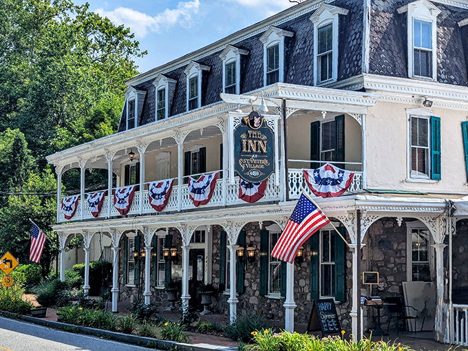 The Logan Inn stands as Ligonier's grand dame, draped in patriotic bunting and historic elegance, like your favorite aunt who always dresses up for Sunday dinner.