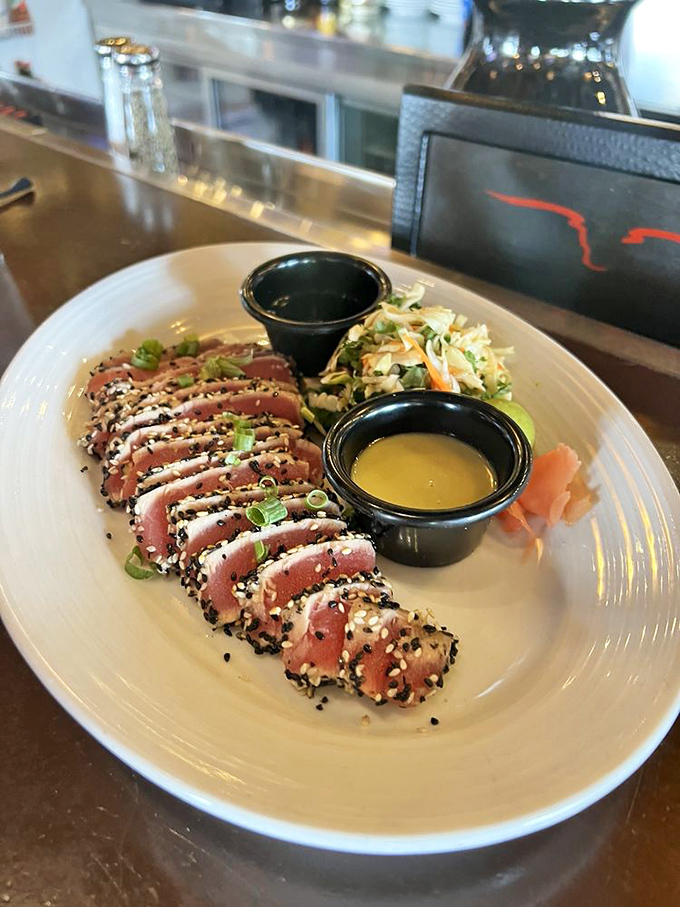 Seared ahi tuna that's dressed for success – rare in the middle, sesame-crusted on the outside, and ready for its close-up.