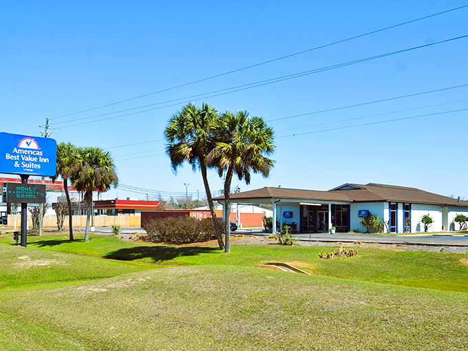 Palm trees frame this roadside inn, a reminder that Foley sits at that perfect sweet spot between small-town charm and beach vacation vibes.