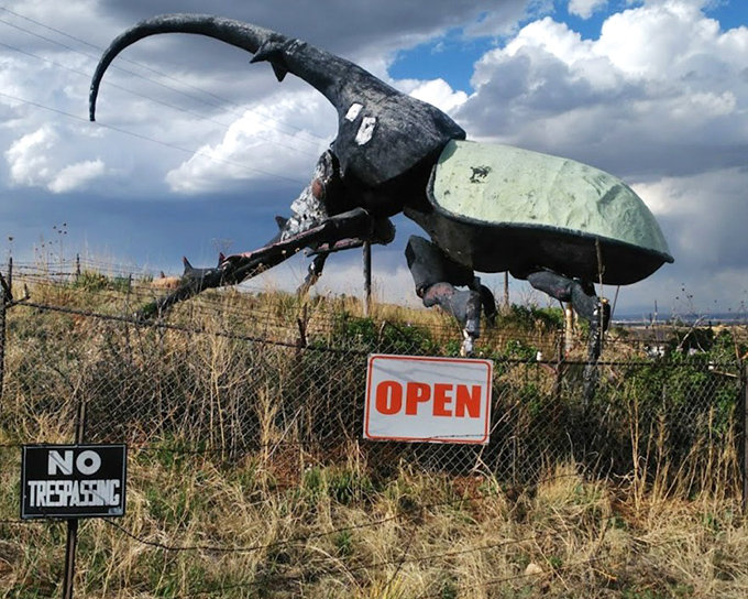 "OPEN" proclaims the sign beneath Herkimer, as if anyone driving by could possibly miss this oversized insect invitation.