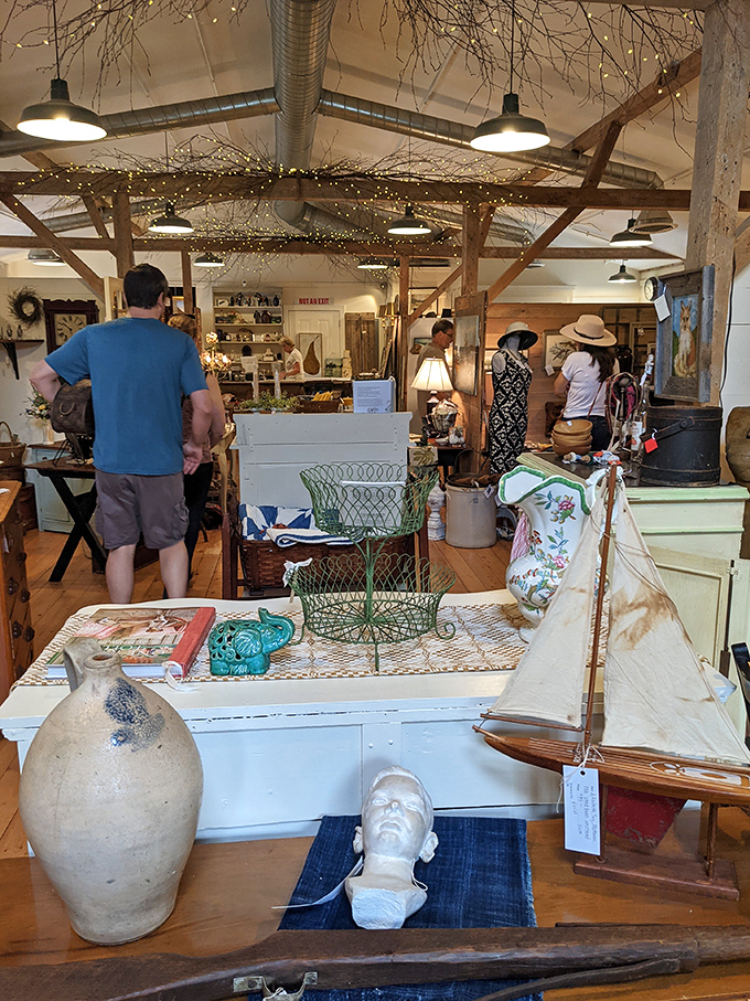 The barn's interior transforms into a curated wonderland where exposed beams and twinkling lights create the perfect backdrop for antiquing magic.