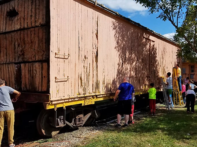 Visitors explore a freight car with the kind of enthusiasm usually reserved for much fancier attractions that charge ten times more money.