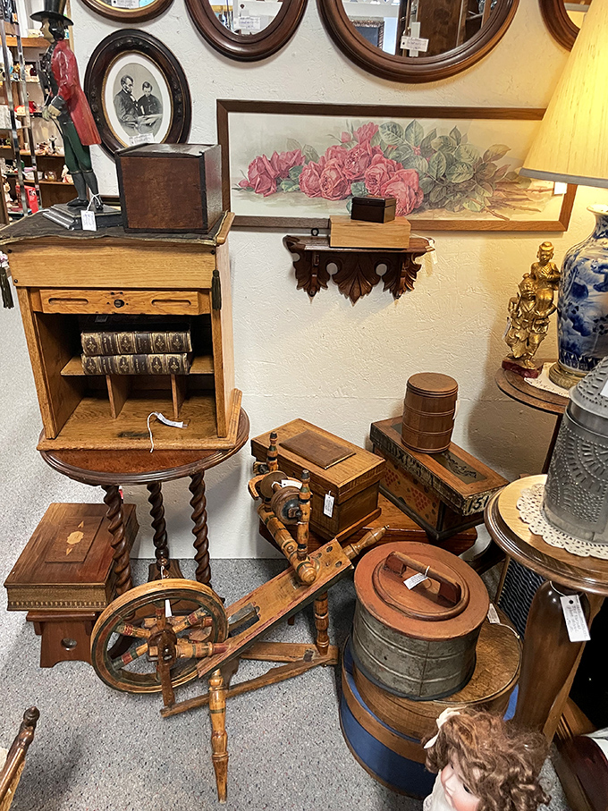 A spinning wheel, oval frames, and wooden treasures that whisper tales from another century. Laura Ingalls Wilder would feel right at home.