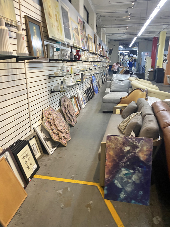 Art and upholstery coexist in perfect harmony, creating a gallery where you can both admire the paintings and take a load off.