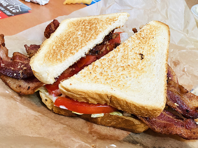 Bacon, lettuce, tomato on toasted bread with extra strips because whoever made this understands priorities and portion control equally.