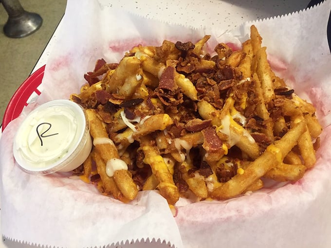 13. These aren't just cheese fries&mdash;they're a masterpiece of excess, where bacon bits and melted cheese transform humble potatoes into something worth driving hours for.cheese fries