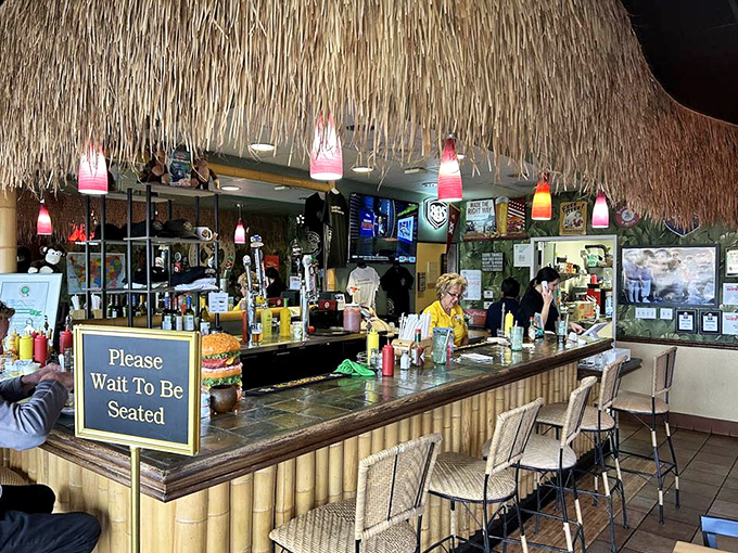 Another angle of the tropical-themed bar where the atmosphere is as carefully crafted as the burgers themselves.