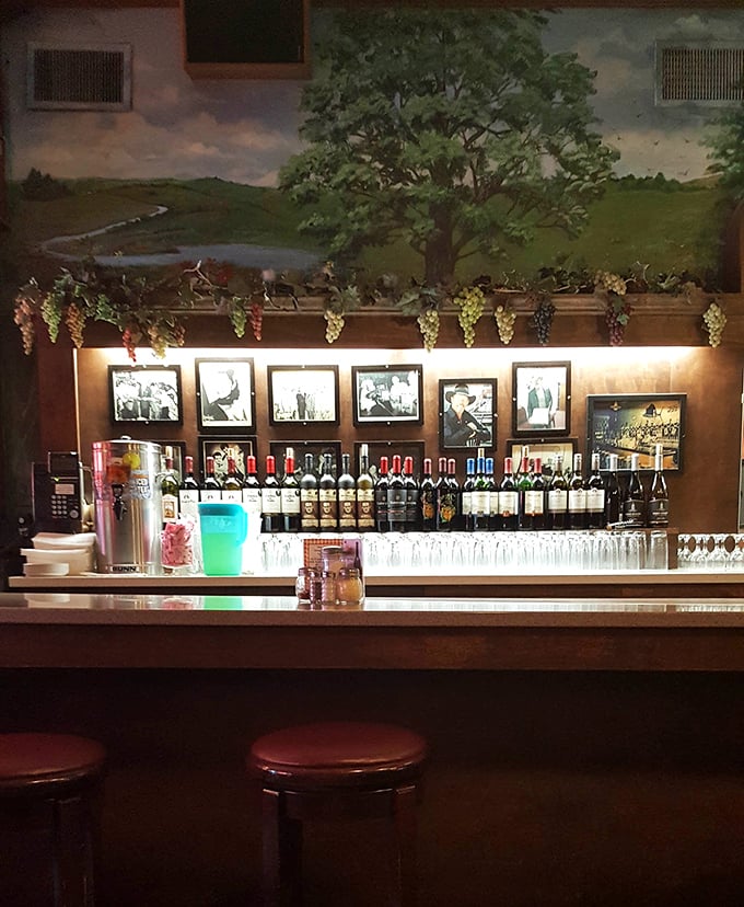 Wine bottles line up beneath vintage photographs, creating the perfect backdrop for that "one more glass" decision we all eventually make.