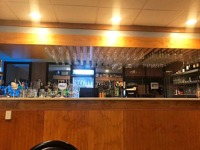 Wine glasses hanging like crystal stalactites &ndash; because sometimes a cold beer isn't the only worthy companion to great seafood.