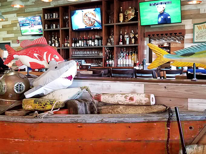 At the bar, colorful fish sculptures swim through air while bottles stand at attention, ready for duty.
