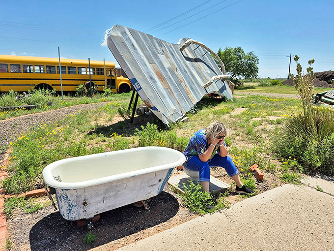 Even the landscaping embraces the wonderfully weird aesthetic with an old bathtub display&mdash;because why not add bathroom fixtures to your beach theme?