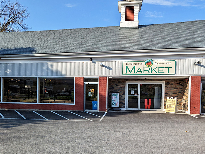 Community market with fresh bread signs &ndash; where locals shop without needing a second mortgage for groceries. 