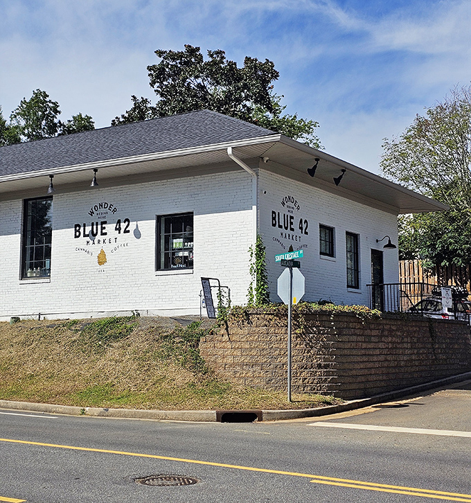 Blue 42 Market's crisp white exterior and corner location make it a neighborhood landmark, where locals gather for more than groceries.