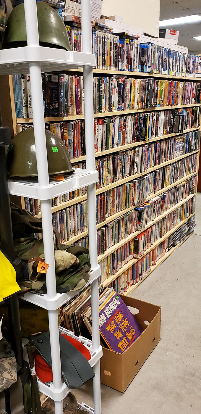 A bibliophile's paradise where DVDs and military helmets create the most unexpected neighbors. This shelf tells stories both within its books and through its eclectic arrangement.