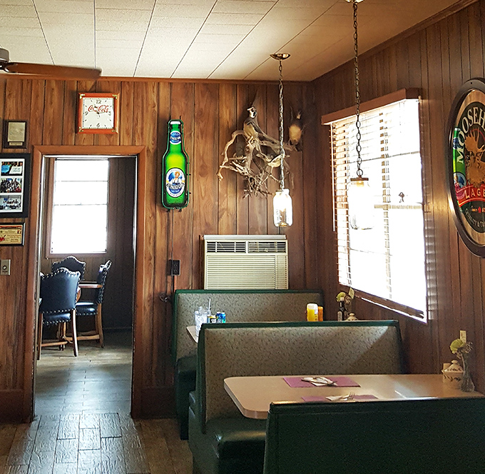 Cozy booths and warm lighting invite you to settle in and stay awhile. The wood-paneled walls have absorbed decades of satisfied sighs.