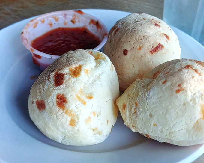 P&atilde;o de queijo&mdash;Brazilian cheese balls with a crisp exterior giving way to a stretchy, cheesy center that makes gluten-free eating feel like cheating.