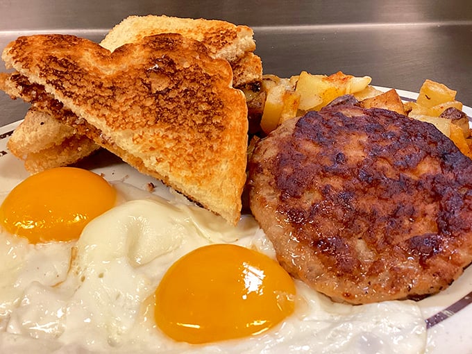 Breakfast of champions&mdash;eggs with yolks as sunny as your server's disposition. That perfectly browned patty isn't just cooked, it's loved.