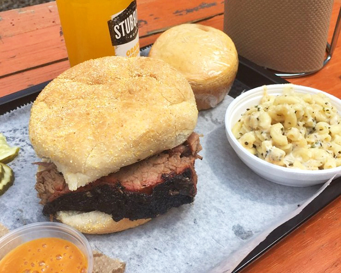 A brisket sandwich that makes you question every other sandwich you've ever committed to. That golden bun is just the beginning of a beautiful relationship.