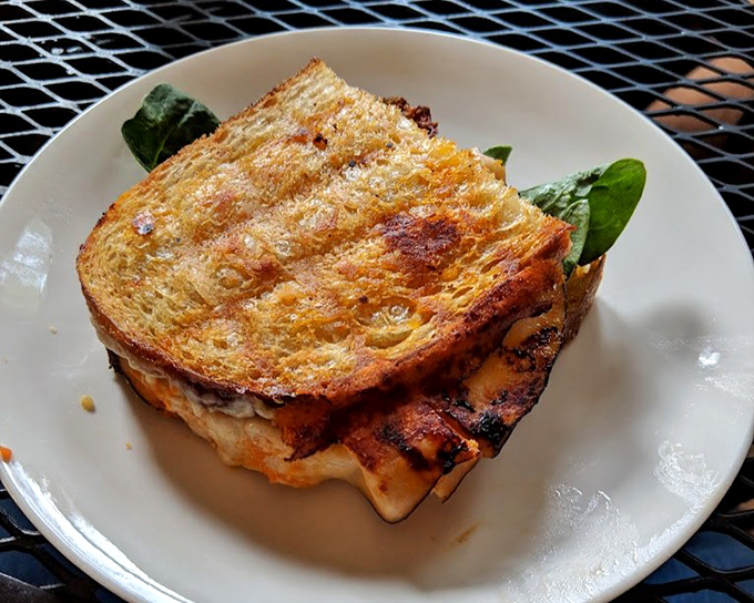 Melty cheese escaping from perfectly grilled bread. This sandwich doesn't just satisfy hunger&mdash;it creates instant food memories.