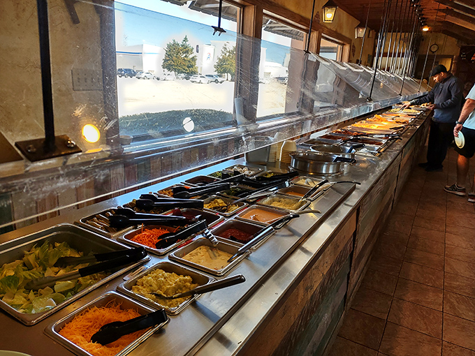 The buffet line gleams like a treasure chest of Southern classics, each tray holding edible gold.