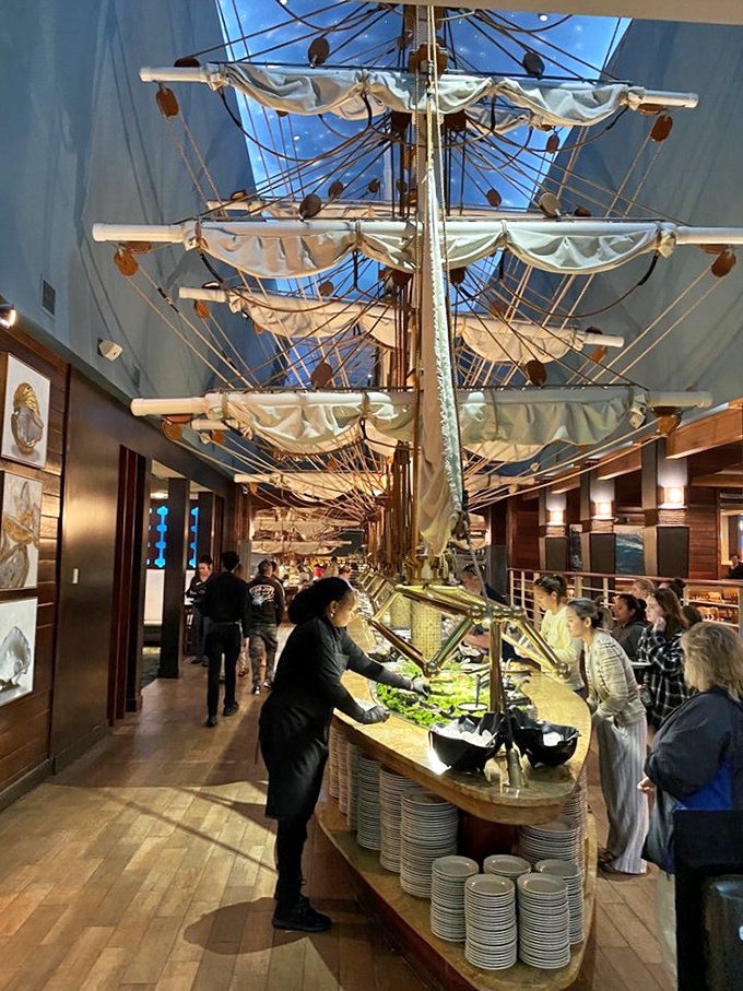 The buffet in full glory—where staff orchestrate a continuous ballet of fresh seafood while hungry patrons plot their strategic plate-filling approach.