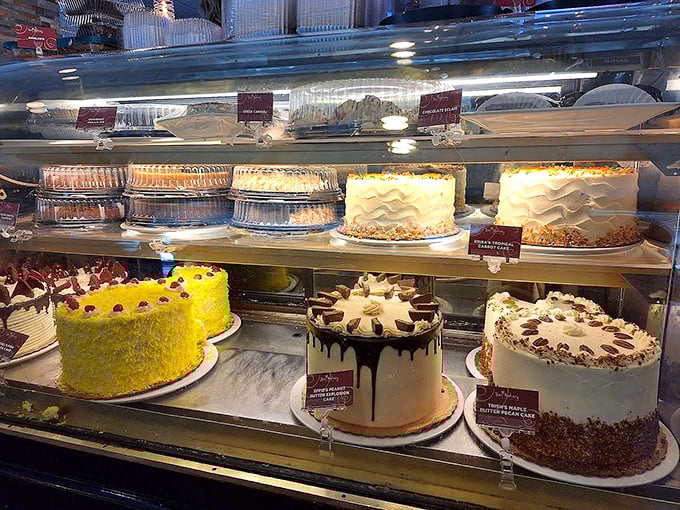 The dessert case that launches a thousand diet exceptions. Each cake is practically its own neighborhood of sweetness, with populations of happy taste buds.