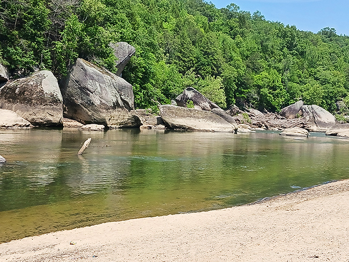 Smooth river stones create nature's most inviting beach, where the water runs clear enough to count fish without even trying.