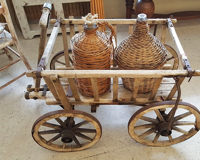 Not your average beverage cart! These wicker-wrapped demijohns once held liquid courage for many a Southern soir&eacute;e.