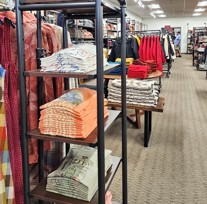 Color-coded clothing racks organized with military precision – making your quest for that perfect sweater surprisingly efficient.