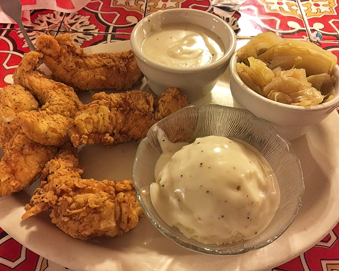 Chicken tenders arrive in a quantity that suggests Mel's doesn't understand the concept of "just a few" and we're grateful.