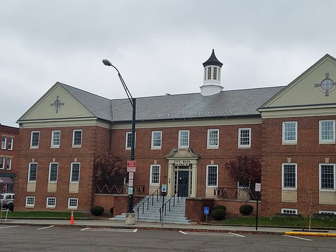 City Hall stands with traditional brick elegance, suggesting government buildings don't need to look like boring concrete bunkers after all.