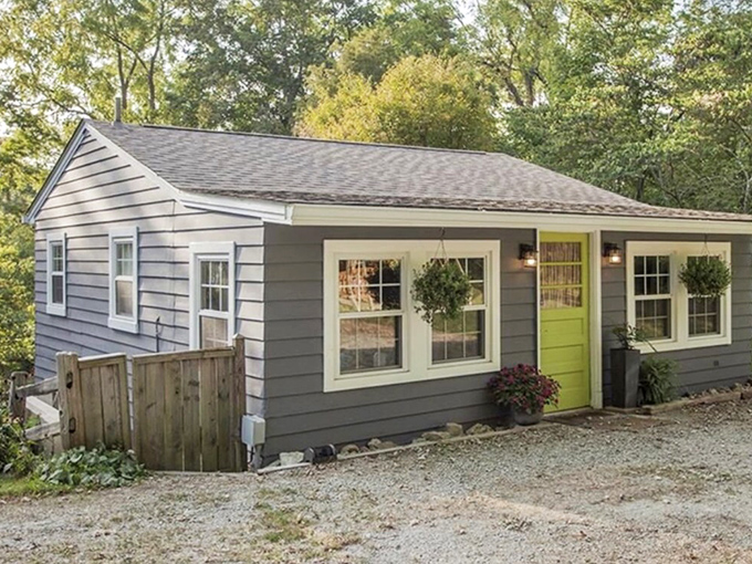 Historic brick buildings with green trim stand as time capsules in Clifton, where autumn leaves frame architecture that whispers stories of Ohio's past.