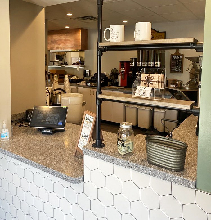 Coffee station perfection—where mugs wait patiently for their moment to shine. The tip jar silently judges your generosity.