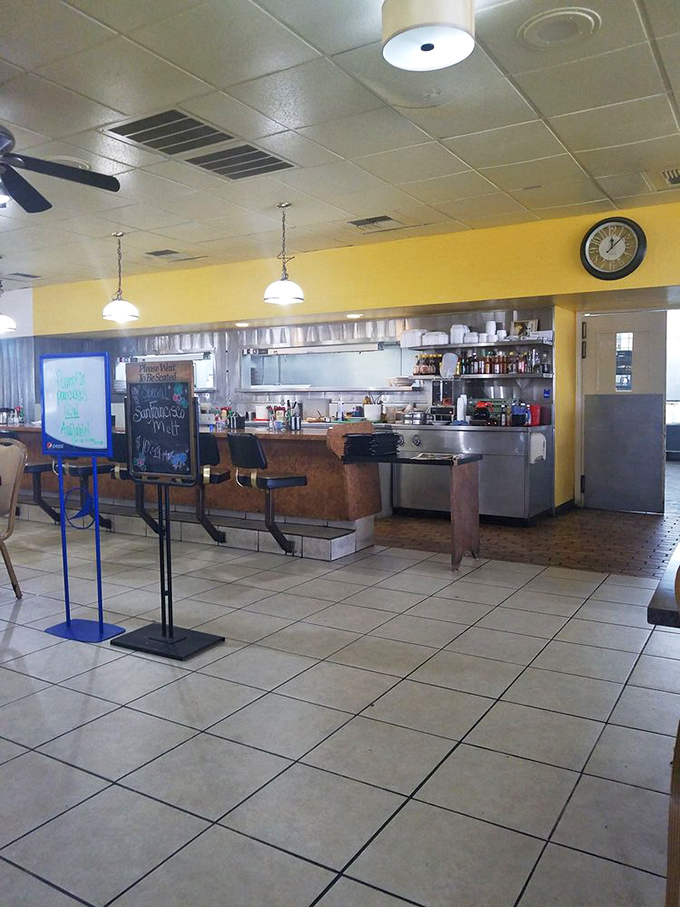 The kitchen pass-through offers a glimpse of breakfast magic in the making. Like watching skilled conductors orchestrate a morning symphony.