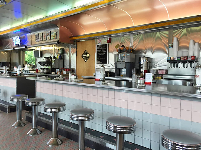 Chrome stools lined up like soldiers ready for the breakfast battle. That counter has heard more Buffalo stories than any therapist in town.