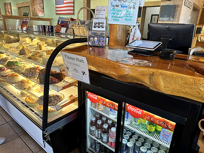 Behind this counter, pie dreams become reality. The display case is like a museum of deliciousness where every exhibit is available for immediate consumption.