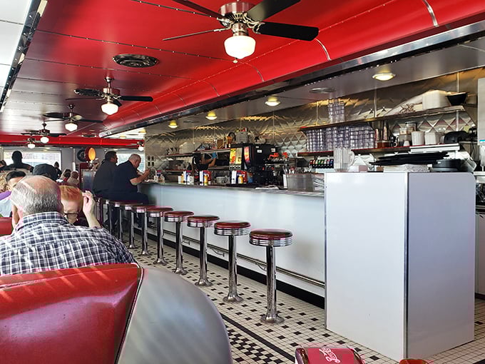 Where decisions are made and coffee flows freely &ndash; Dixie's counter seating offers front-row views to short-order culinary magic.