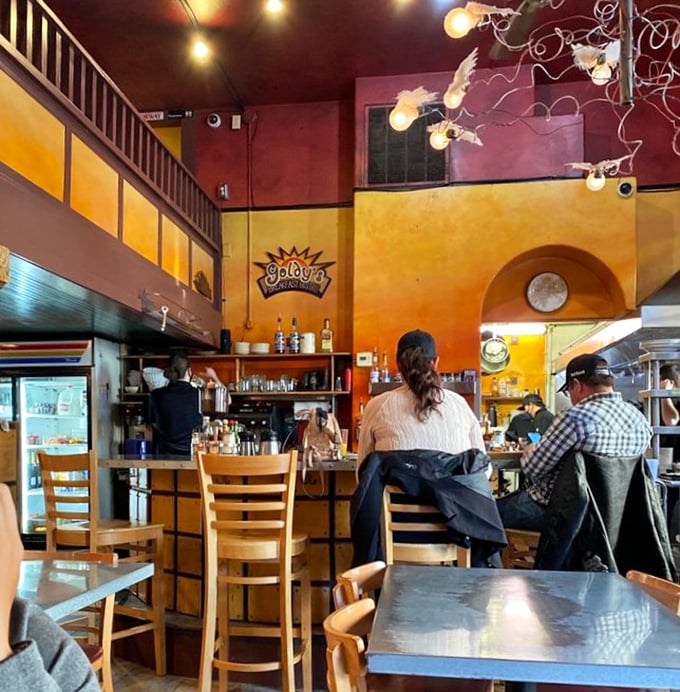 Counter seating offers front-row tickets to the breakfast show. Sometimes the best dining companions are strangers with good taste.