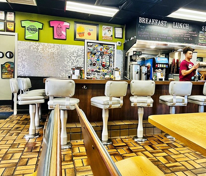 Counter seats offer front-row tickets to the culinary show, where regulars exchange knowing nods over coffee refills.