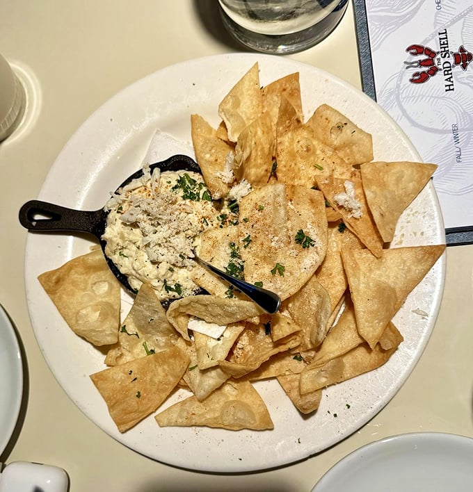 Hot crab dip with crispy chips proves that melted cheese and fresh crab were always meant to be together.