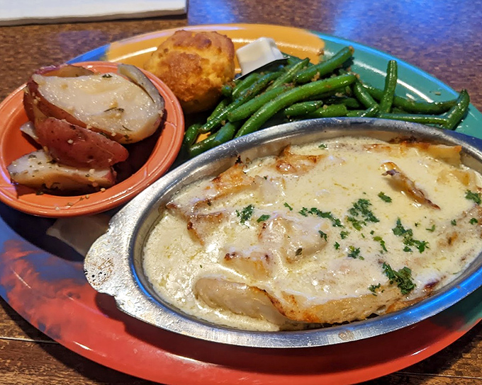 Crab-stuffed haddock swimming in cream sauce&mdash;this is what happens when seafood decides to dress up fancy.