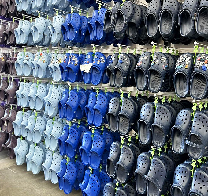 The Crocs rainbow wall &ndash; where practical footwear comes in enough colors to match every outfit you own, whether you admit wearing them or not.