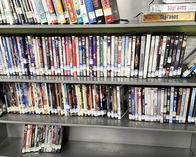The DVD archive—physical media's last stand. Spot those "Sopranos" box sets? Perfect for binge-watching when your internet goes out during a New England storm.