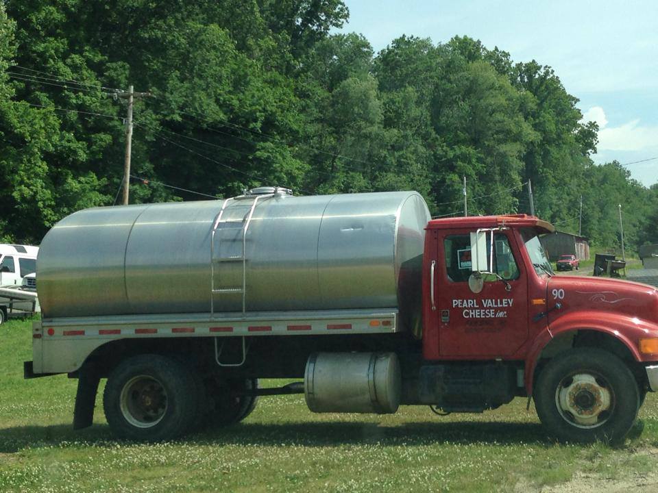 The milk truck cometh! This silver tanker is basically a dairy superhero, delivering the essential ingredient for tomorrow's cheese treasures.