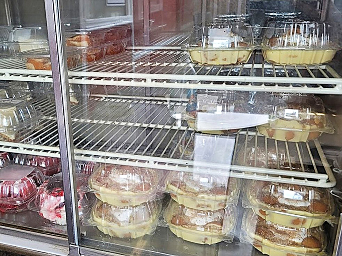 The dessert case: where willpower goes to die a happy, sweet death. Each container holds a different path to bliss.