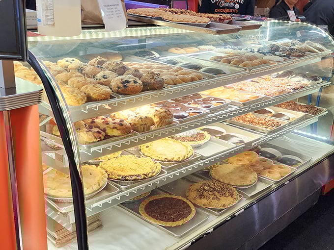 A glass case of caloric dreams: pies, cookies, and pastries that have been ending diets and starting smiles for generations of Marylanders.