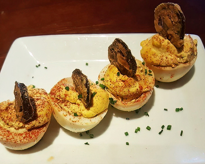 These deviled eggs aren't just appetizers&mdash;they're tiny flavor bombs topped with crispy bacon that'll have you wondering why you'd ever make them at home again.