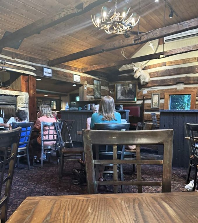 Antler chandeliers and log walls create the perfect backdrop for the age-old tradition of ignoring your phone and actually talking.