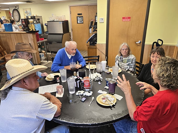 Regulars gather around tables, swapping stories and savoring breakfast &ndash; a morning ritual that builds community one biscuit at a time.