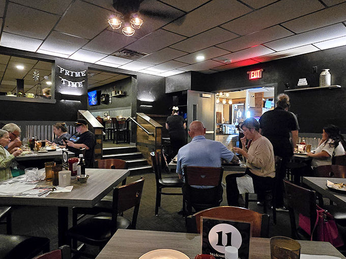 Diners settle in beneath the "Prime Time" sign, where conversations flow as freely as the cocktails.